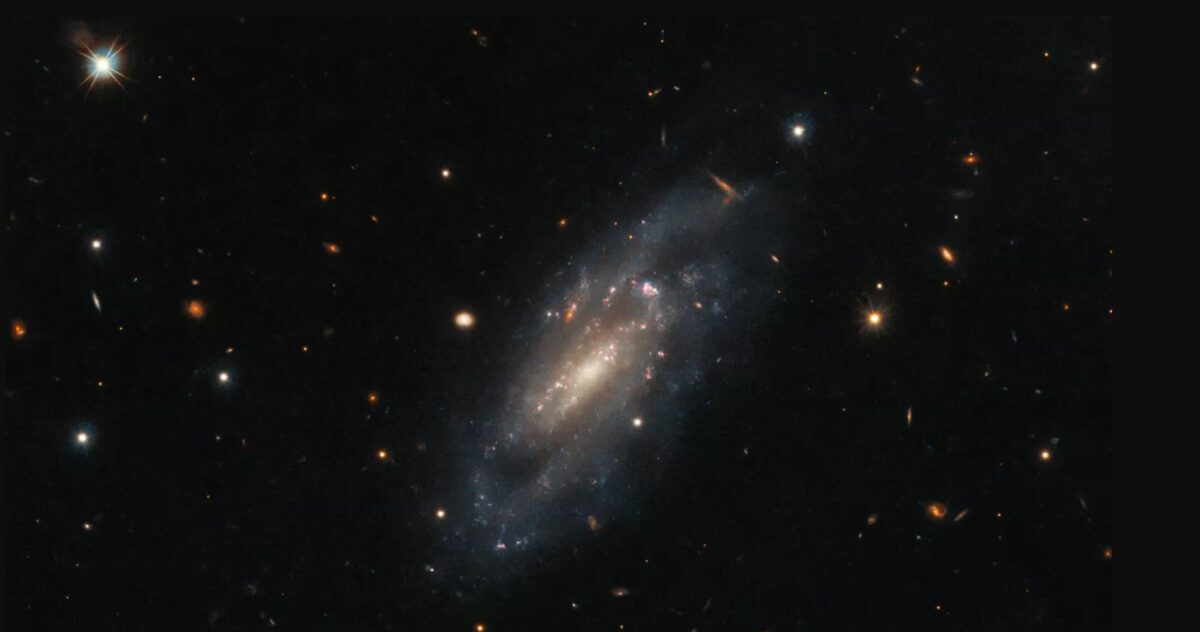 The Hubble Space Telescope took a picture of a spiral galaxy in the ...